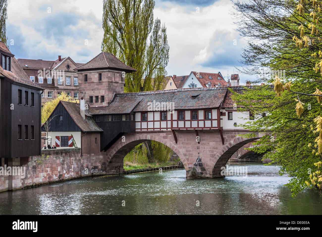 Pegnitz river with the Henkersteg footbridge and the Henkerhaus ...