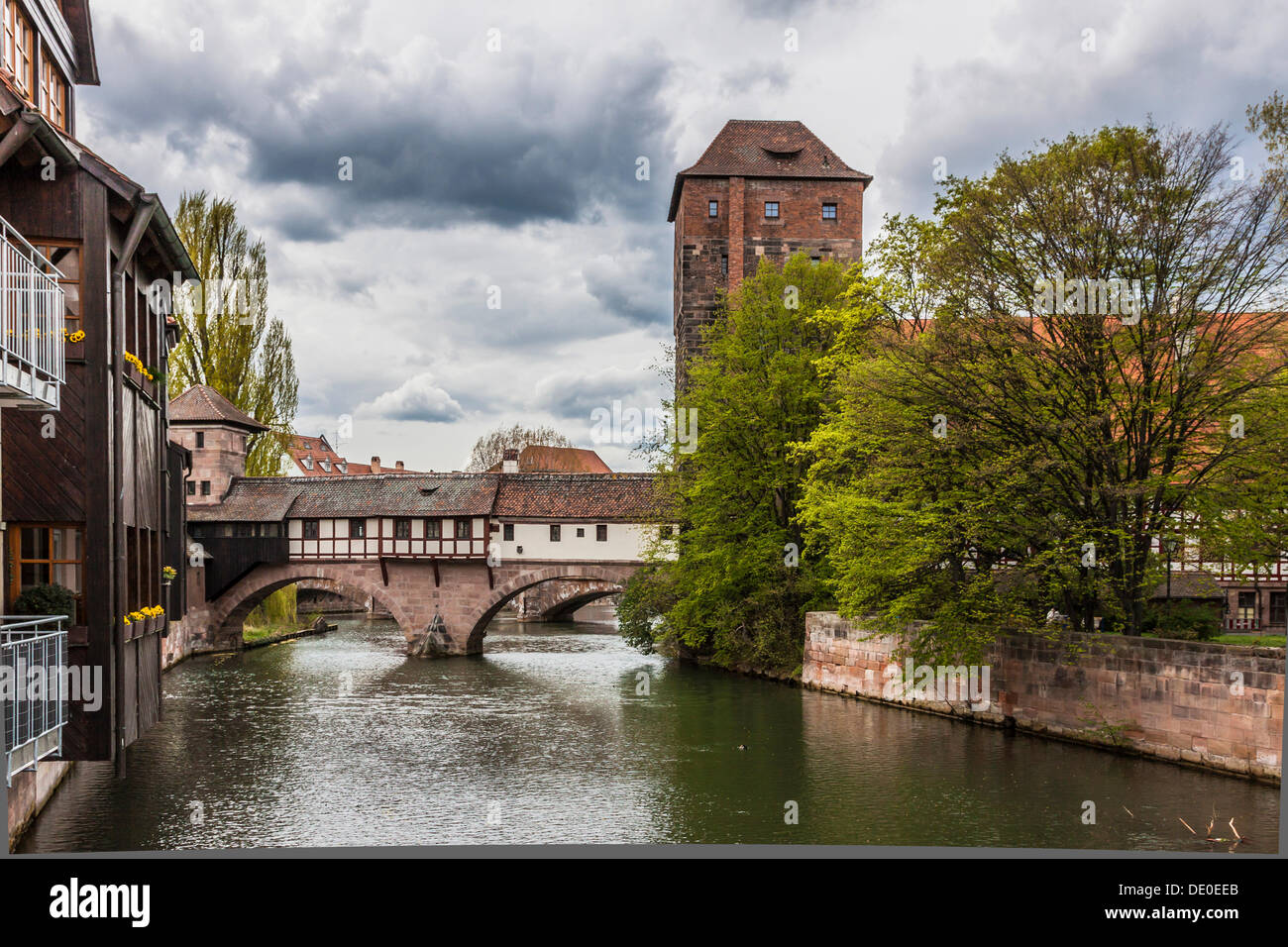 Pegnitz river with the Henkersteg footbridge and the Henkerhaus ...