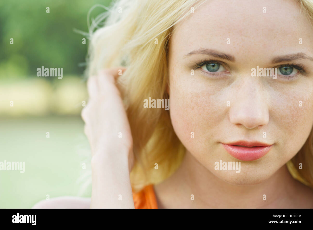 Hand touches hair hi-res stock photography and images - Alamy