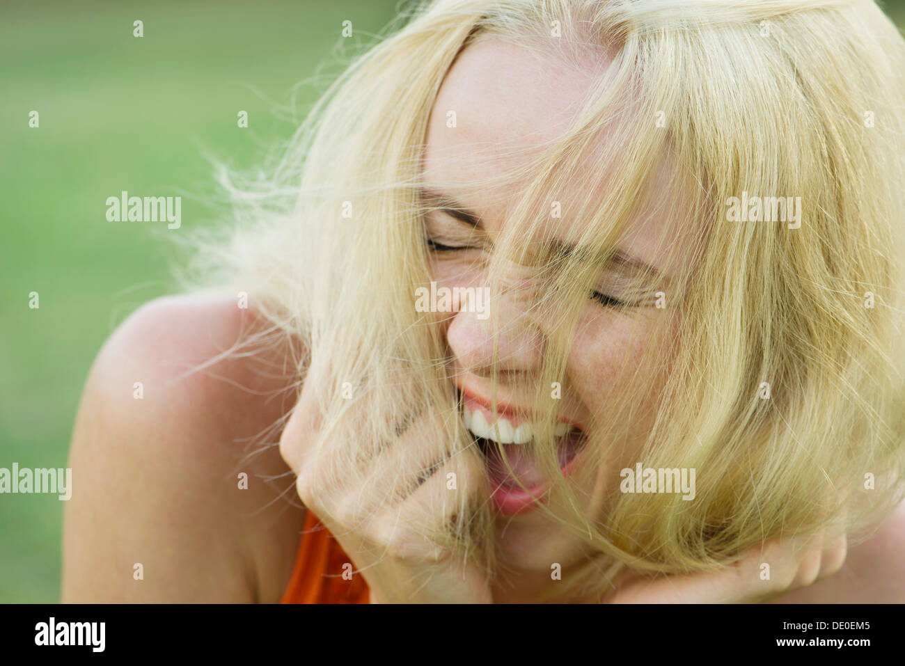 Young woman bursting out laughing hi-res stock photography and images ...