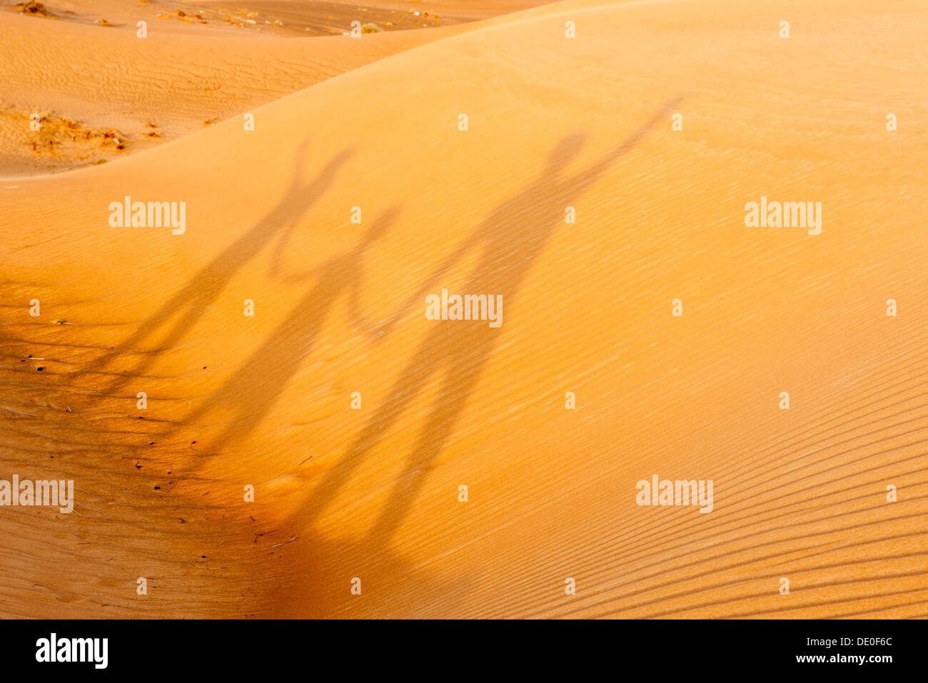Three shadows holding hands hi-res stock photography and images - Alamy