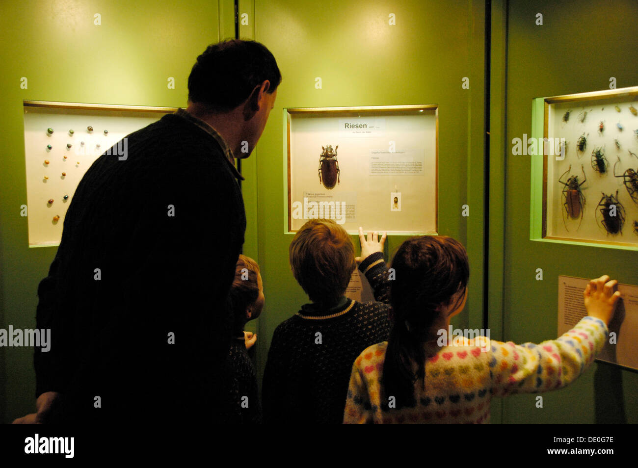 Father with children in the Insects exhibition in the Museum of Man and ...