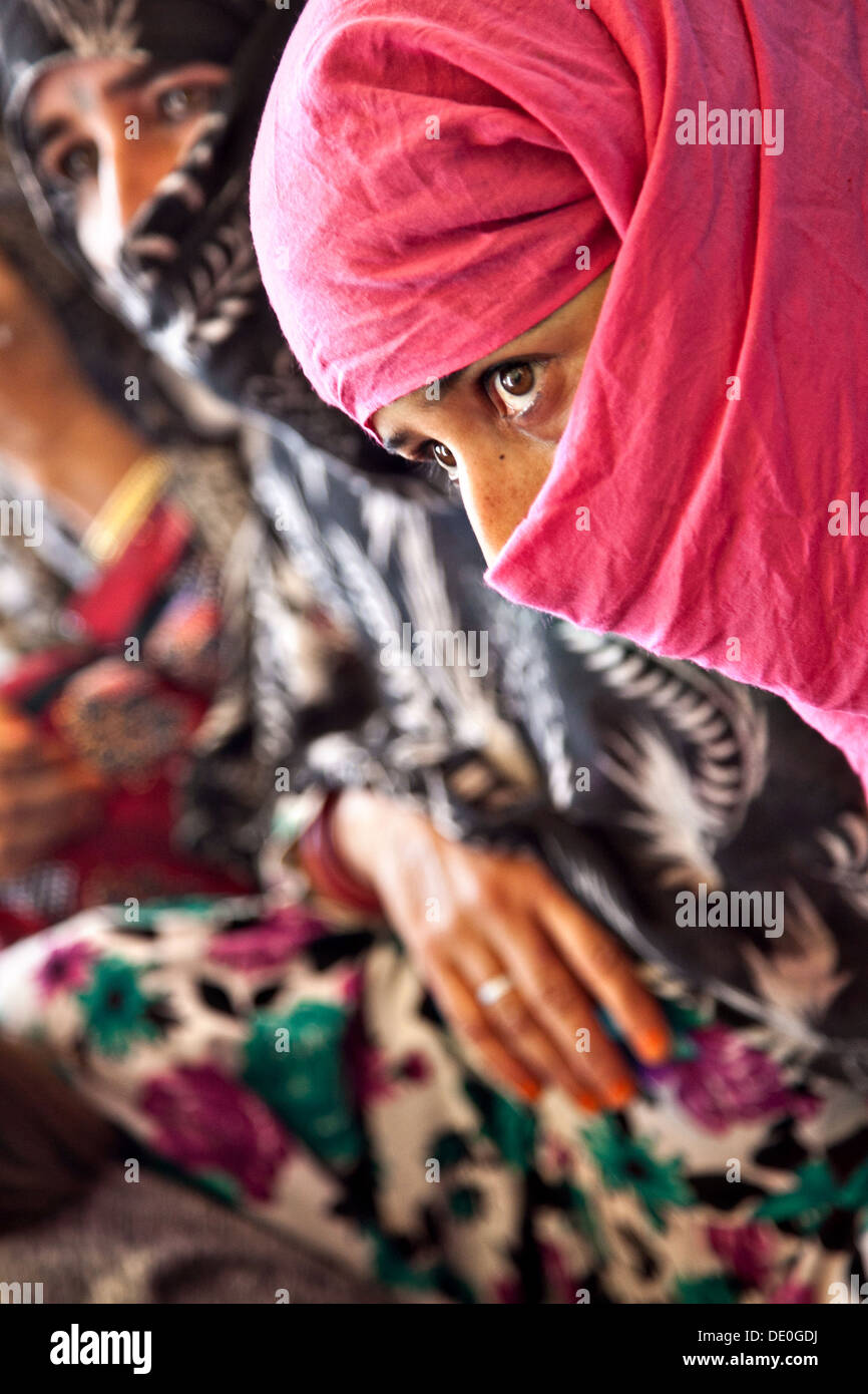 Afghan women in full body covering listen to a lecture on emergency ...