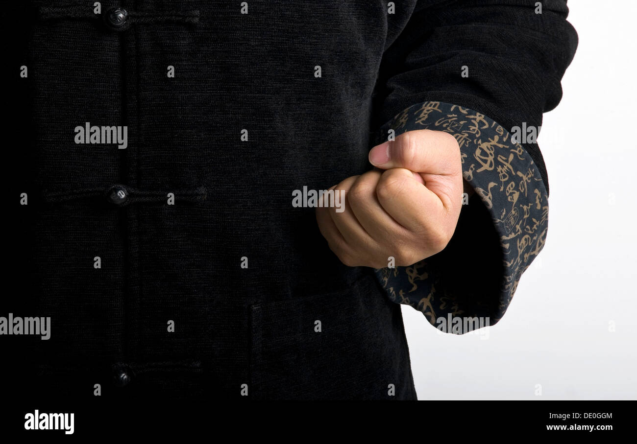 Combative fist of a Chinese Taiji Master, section of traditional jacket ...