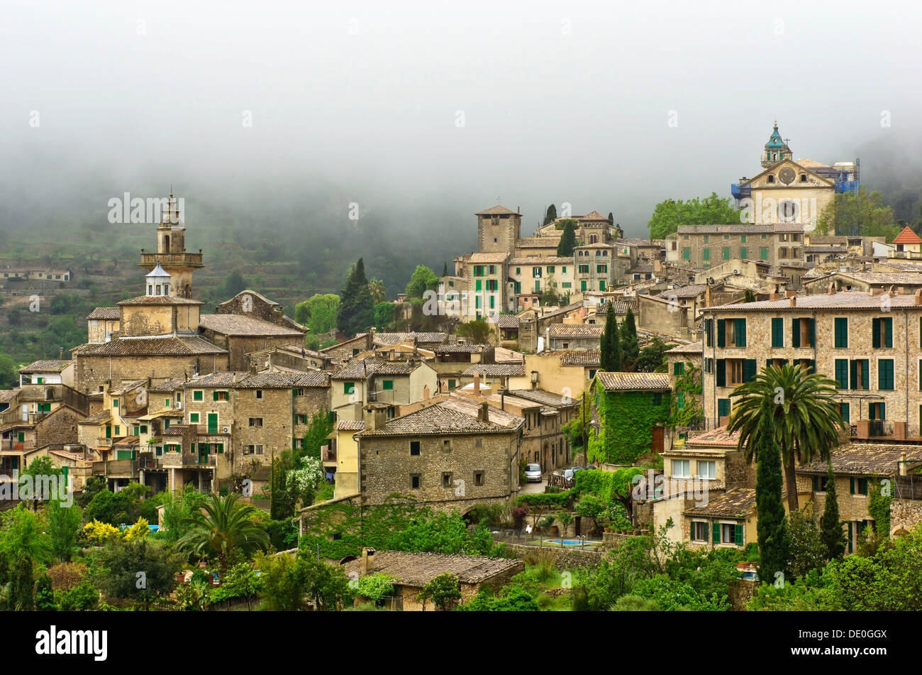 Village view with rain clouds, behind the Carthusian monastery, in ...