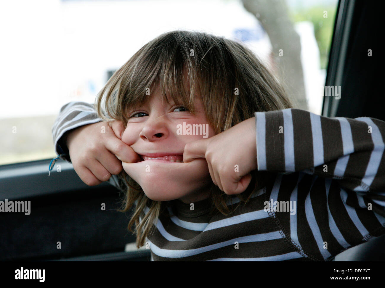 Boy making grimace camera hi-res stock photography and images - Alamy
