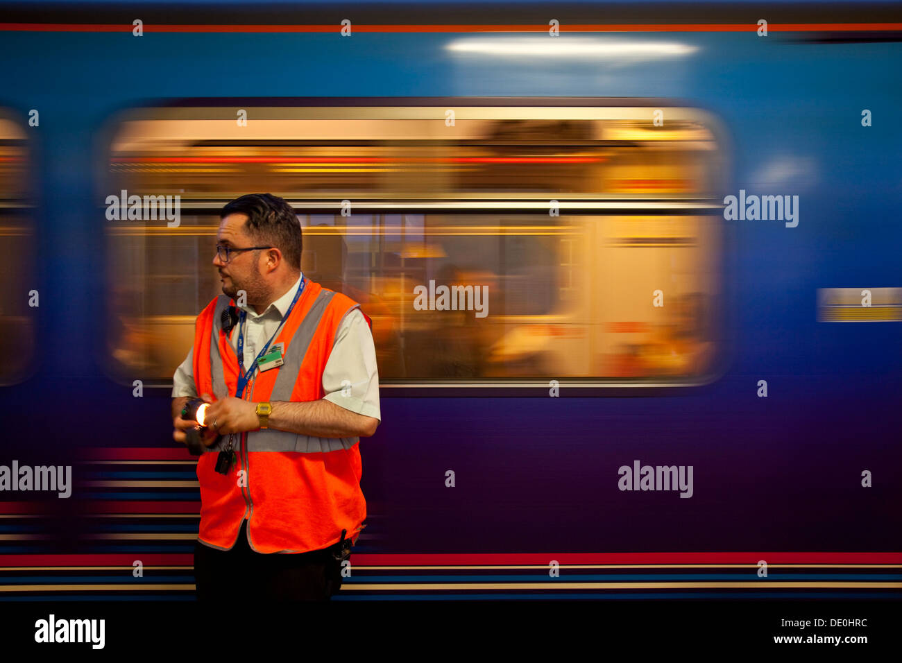 Station Guard and Moving Train, Haywards Heath Train Station, West ...