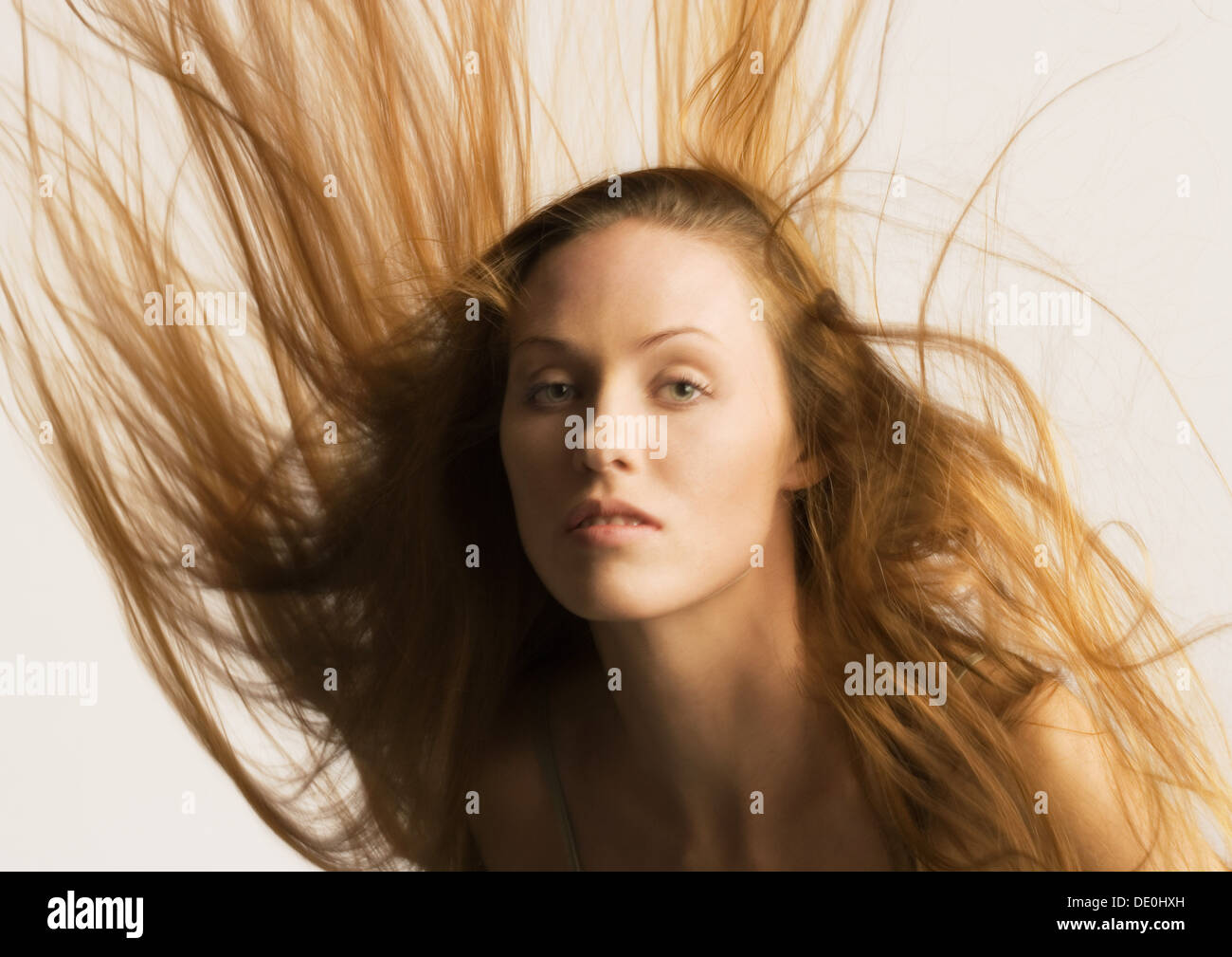 Woman, long hair being tousled Stock Photo - Alamy