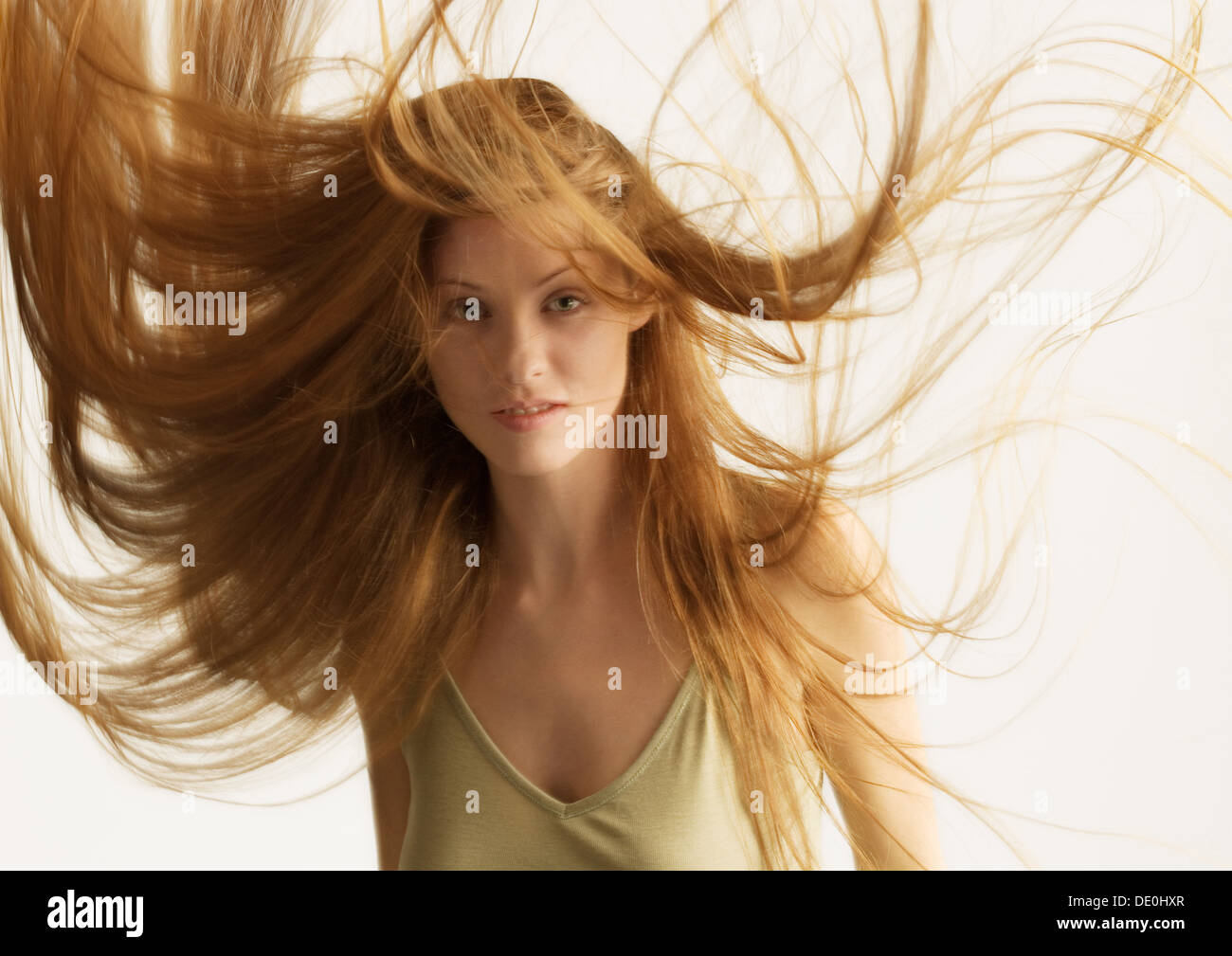 Woman, long hair being tousled Stock Photo - Alamy