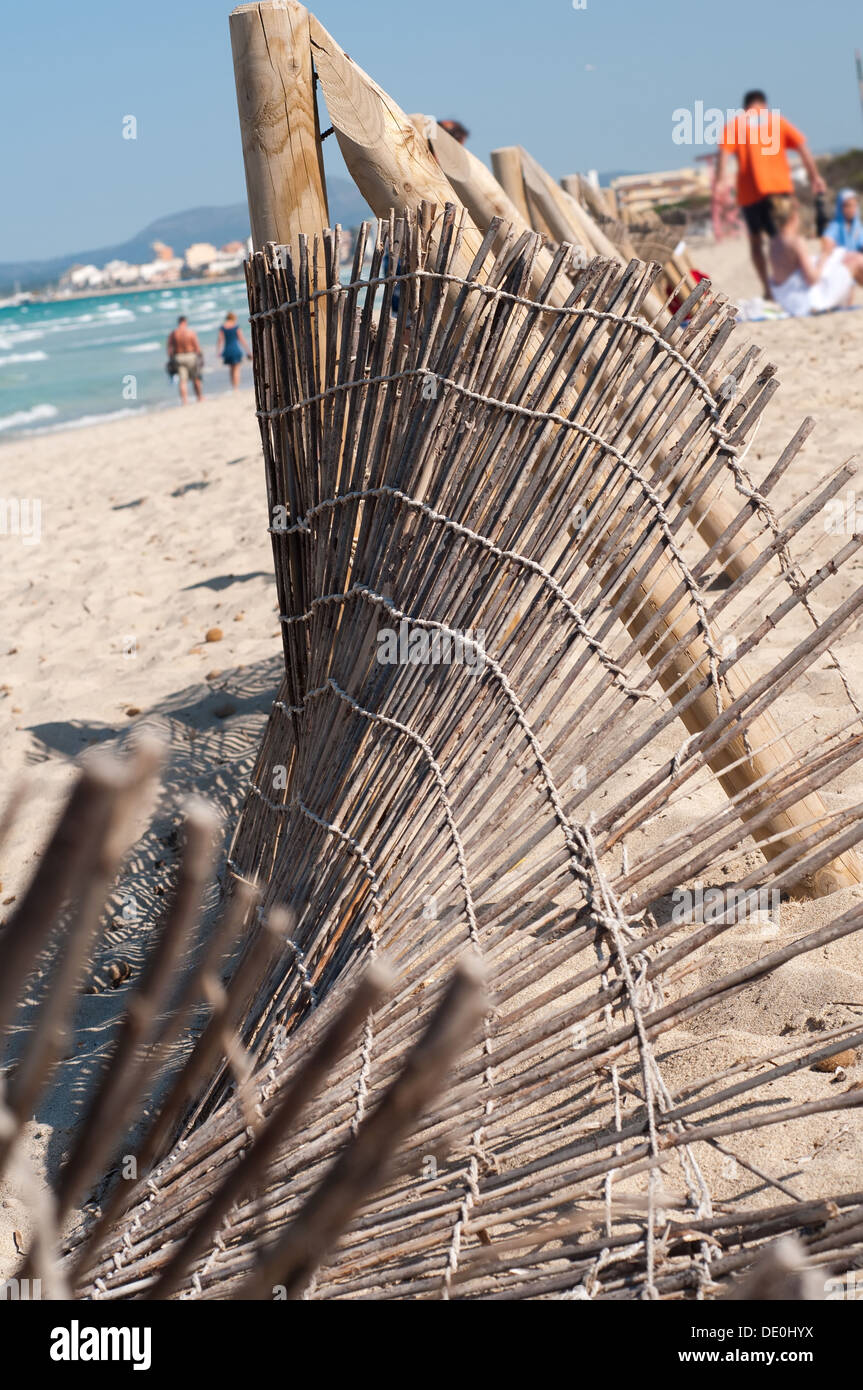 Shot of fence on the beach, blue sky and sand Stock Photo - Alamy
