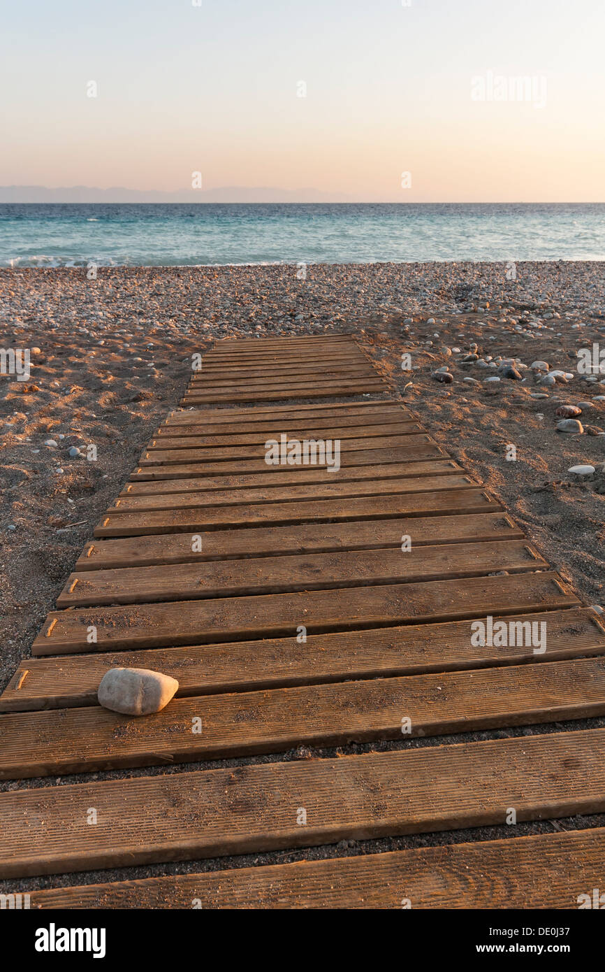 Catwalk on the beach during sunrise Stock Photo - Alamy