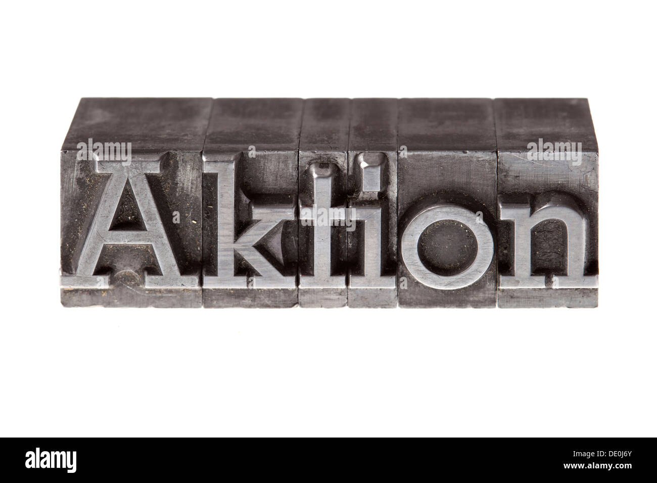 Old lead letters forming the word "Aktion", German for "action Stock ...