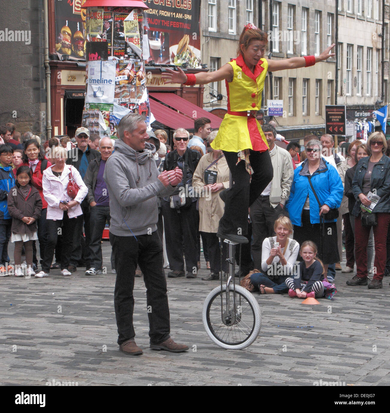 Lady riding a unicycle hi-res stock photography and images - Alamy