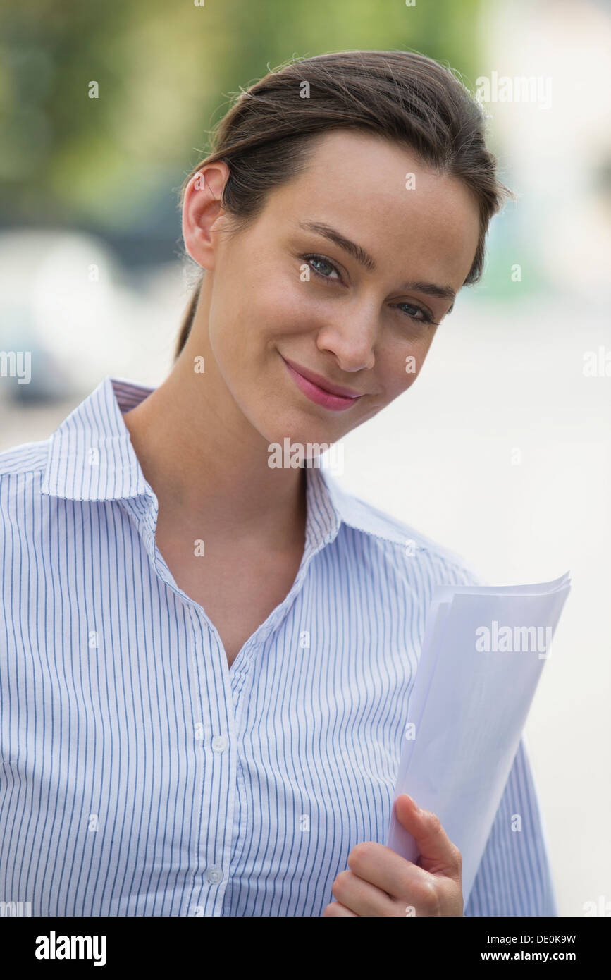 Carrying under arms hi-res stock photography and images - Alamy