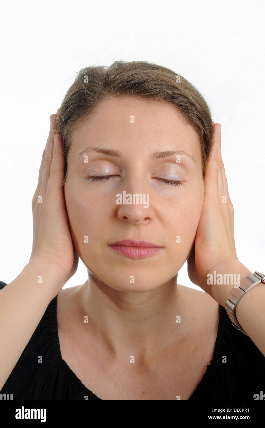 Young woman covering the ears with her hands Stock Photo - Alamy