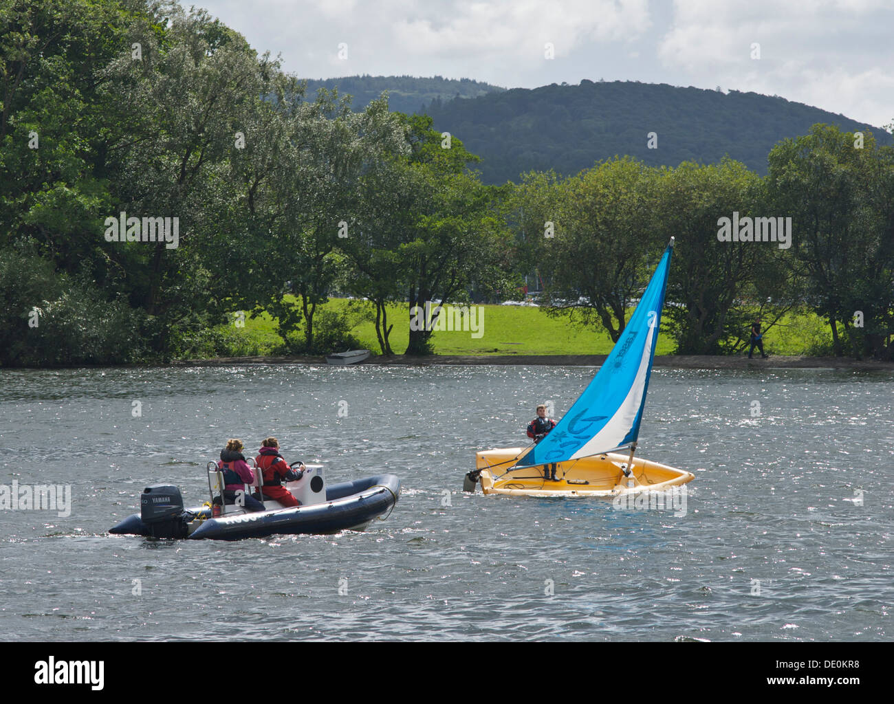 Inflatable boat and sailing boat on Lake Windermere, Lake District ...