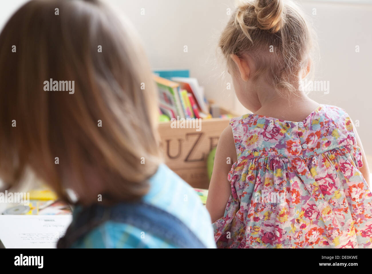 Children looking at books Stock Photo - Alamy