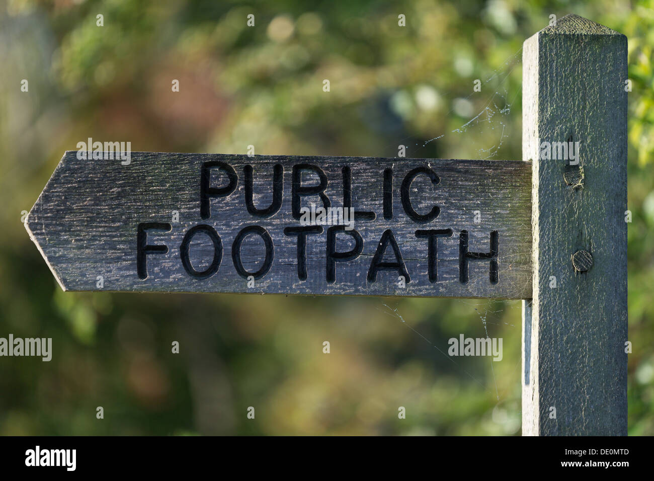 Public footpath sign and post for walk along side of the river Brue ...