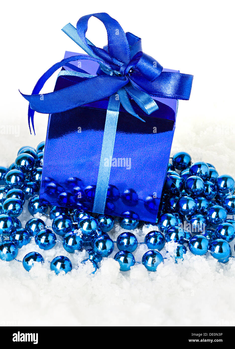 Christmas present up on snow background Stock Photo - Alamy