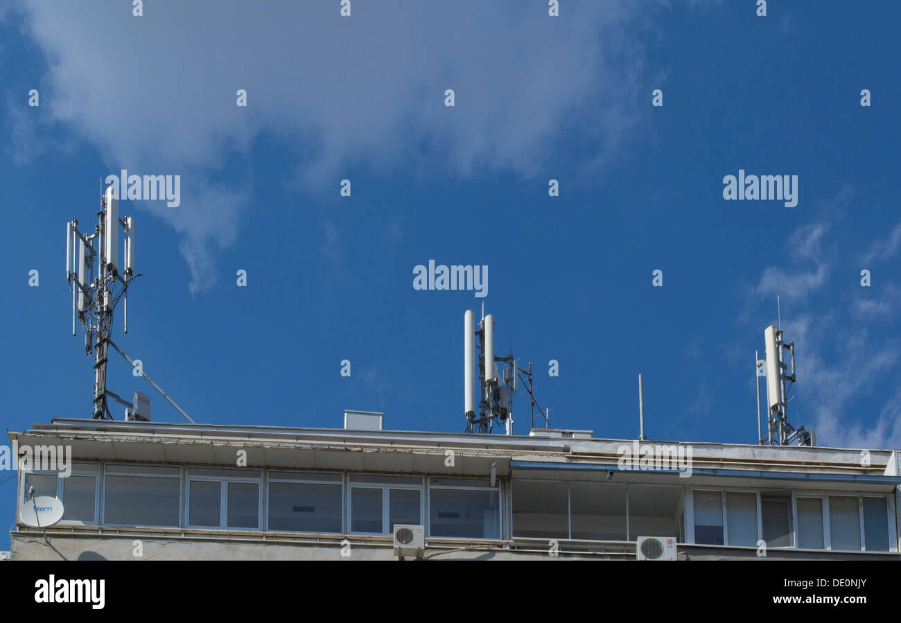 Radio masts on a building Stock Photo - Alamy
