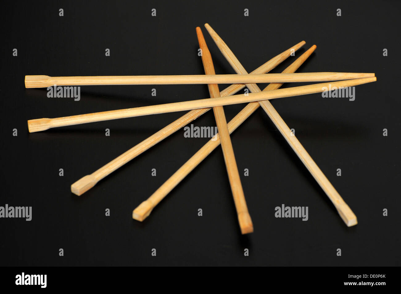 Chopsticks photographed against a black background Stock Photo - Alamy