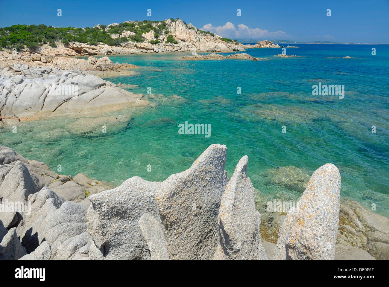 Bizarre, weathered granite rock boulders in crystal-clear turquoise ...