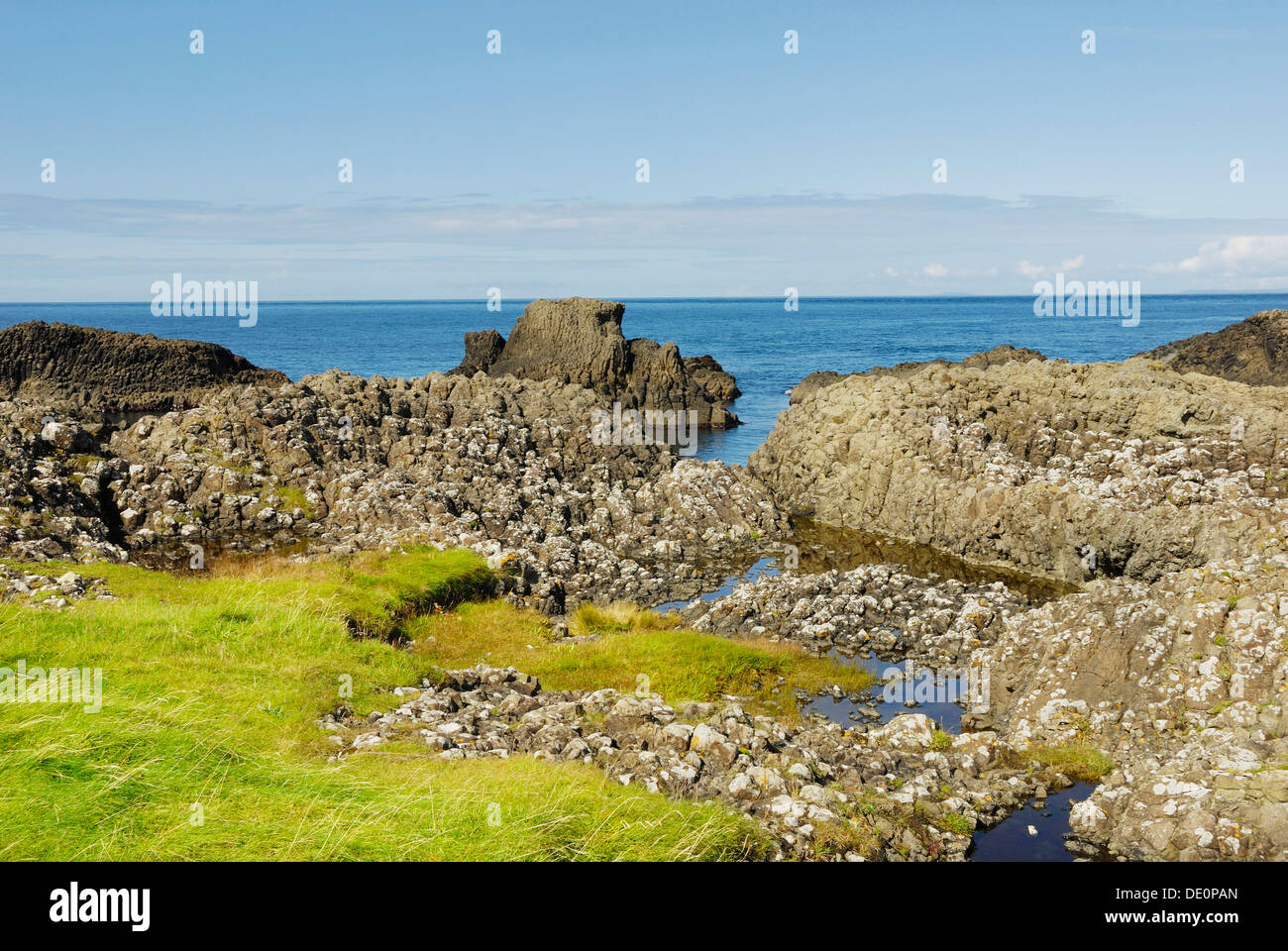 Bog pools in weathered basalt blocks at Northern Irish coast at ...