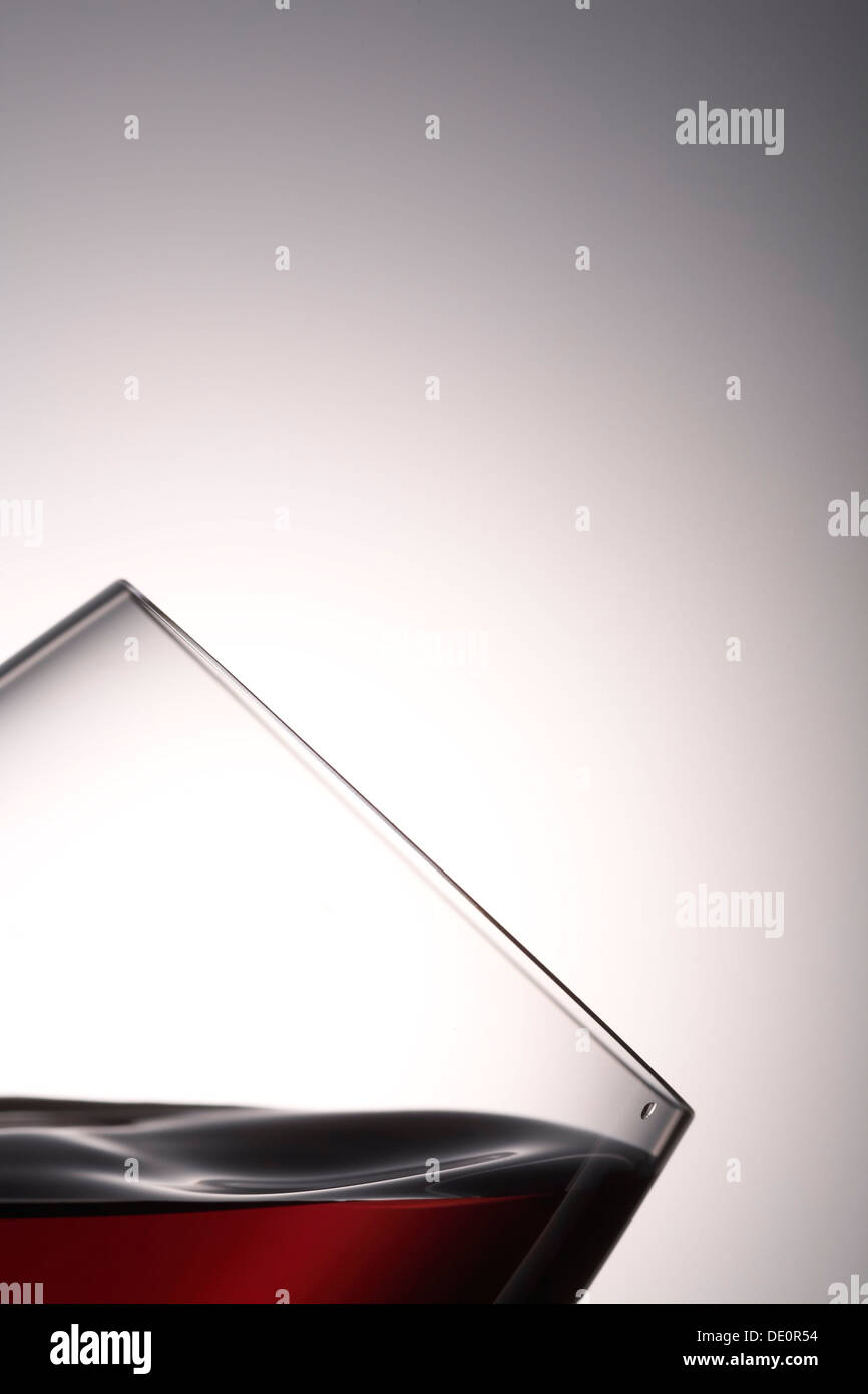 Inclined glass of wine Stock Photo - Alamy