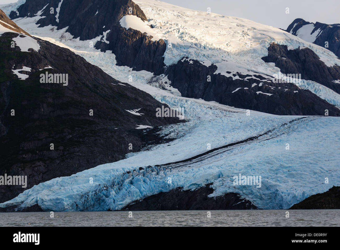 Portage glacier slides down to water Stock Photo - Alamy