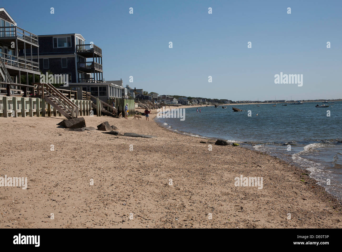The inner harbor beach of Provincetown Massachusetts shows the curve of ...
