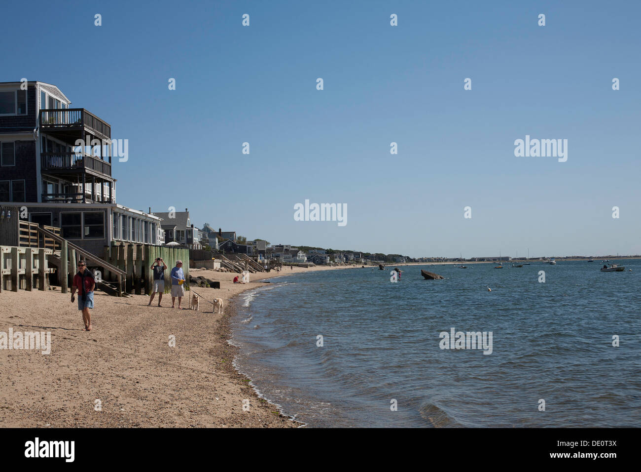 The inner harbor beach of Provincetown Massachusetts shows the curve of ...