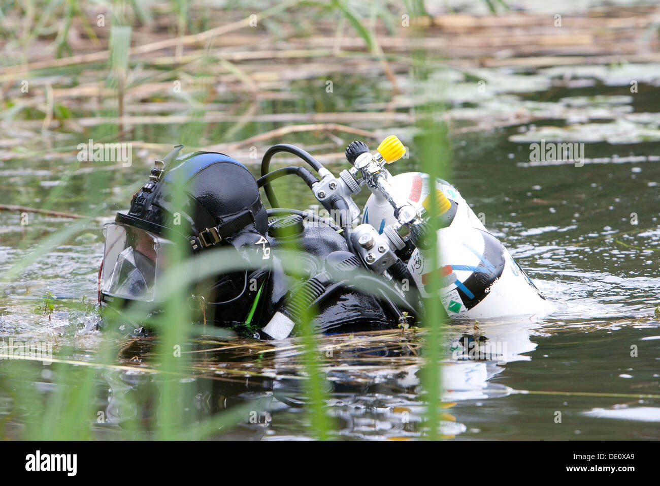 Police diver in a lake Stock Photo - Alamy