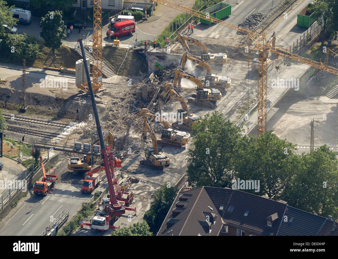 Aerial view, 8 demolition crawler excavators working on the demolition ...