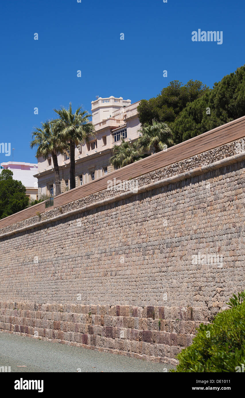 Period building surrounded by the old city wall, Cartagena, Spain Stock ...