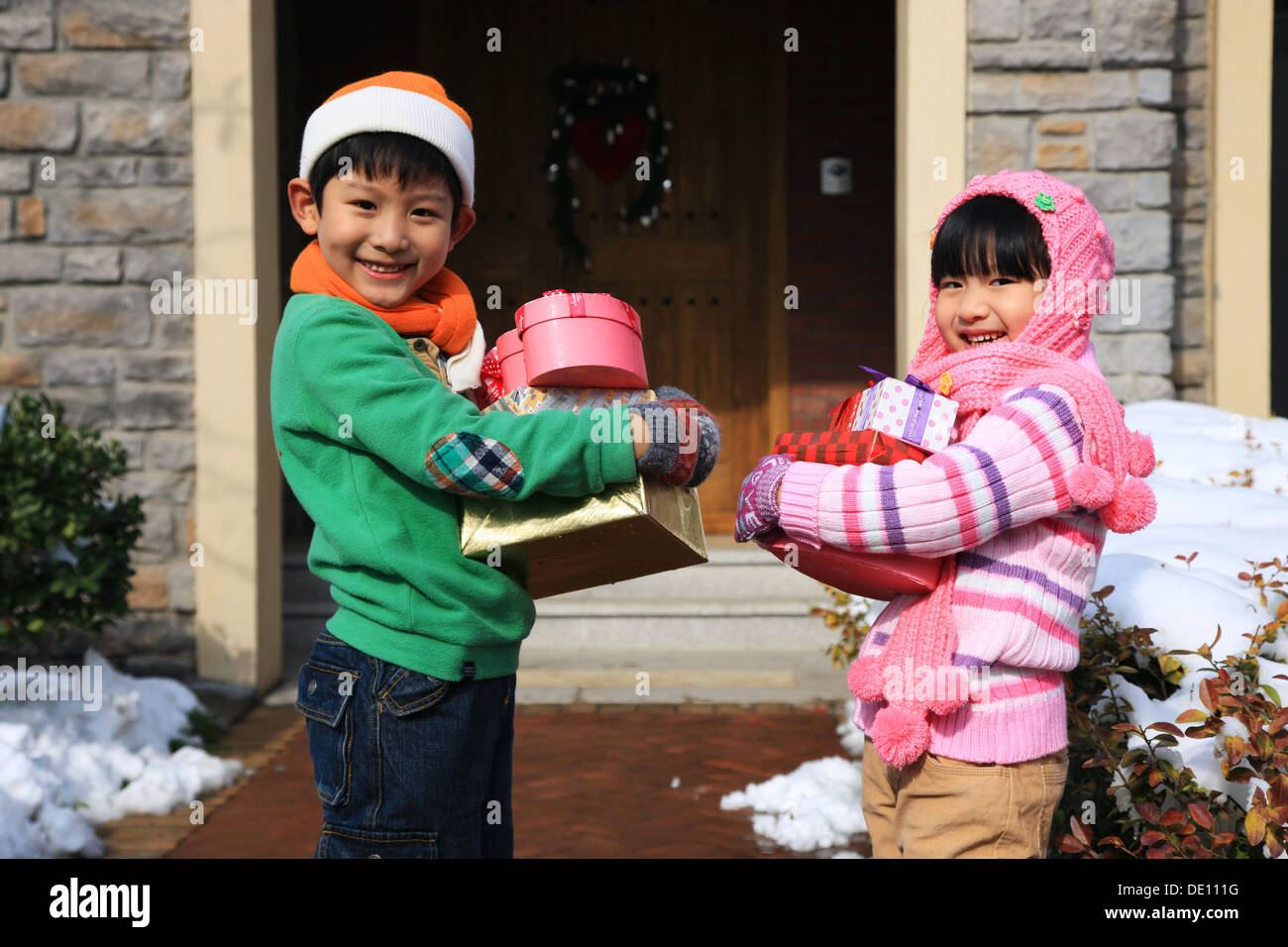 Children holding gift boxes Stock Photo - Alamy