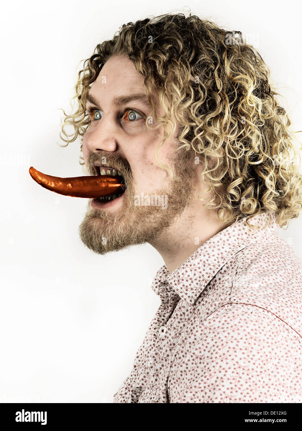 young man furious evil looking with a huge tongue Stock Photo - Alamy