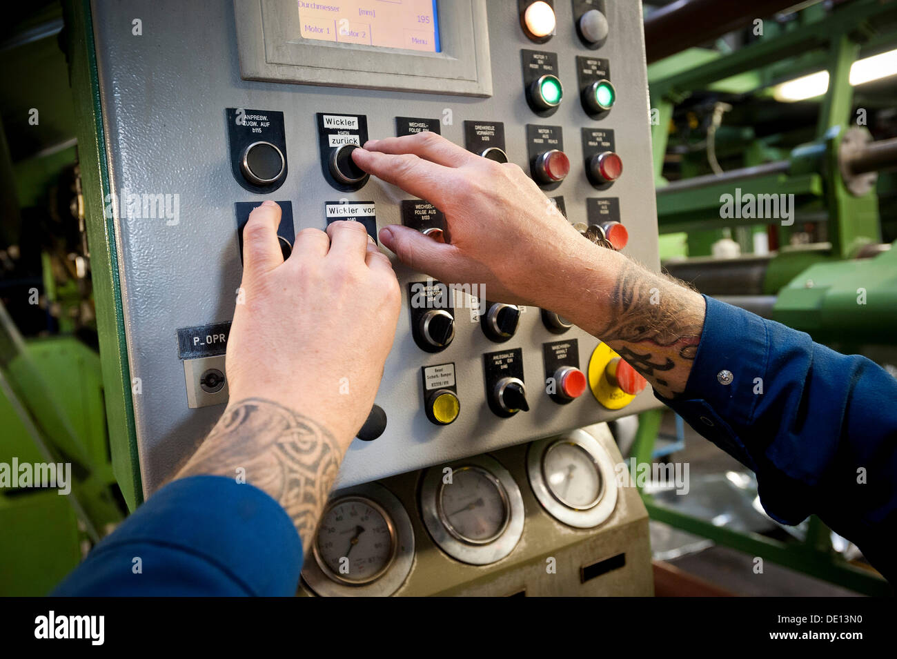 Hands operating a control unit, lamination, Huhtamaki Germany GmbH & Co ...