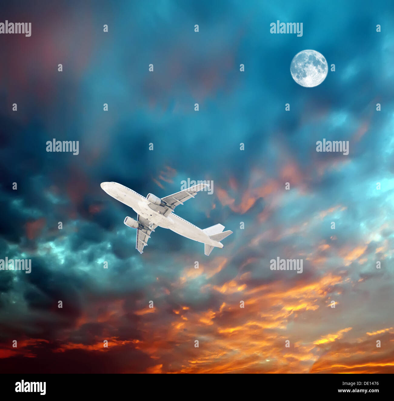 A plane flying high in the nighttime sky with an illuminated moon Stock ...