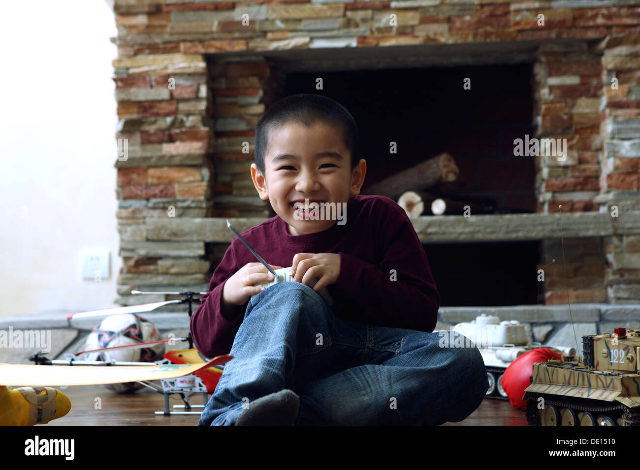 6-7 year old boy playing at home Stock Photo - Alamy