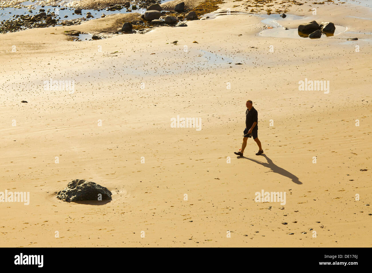 Man on beach open hi-res stock photography and images - Alamy