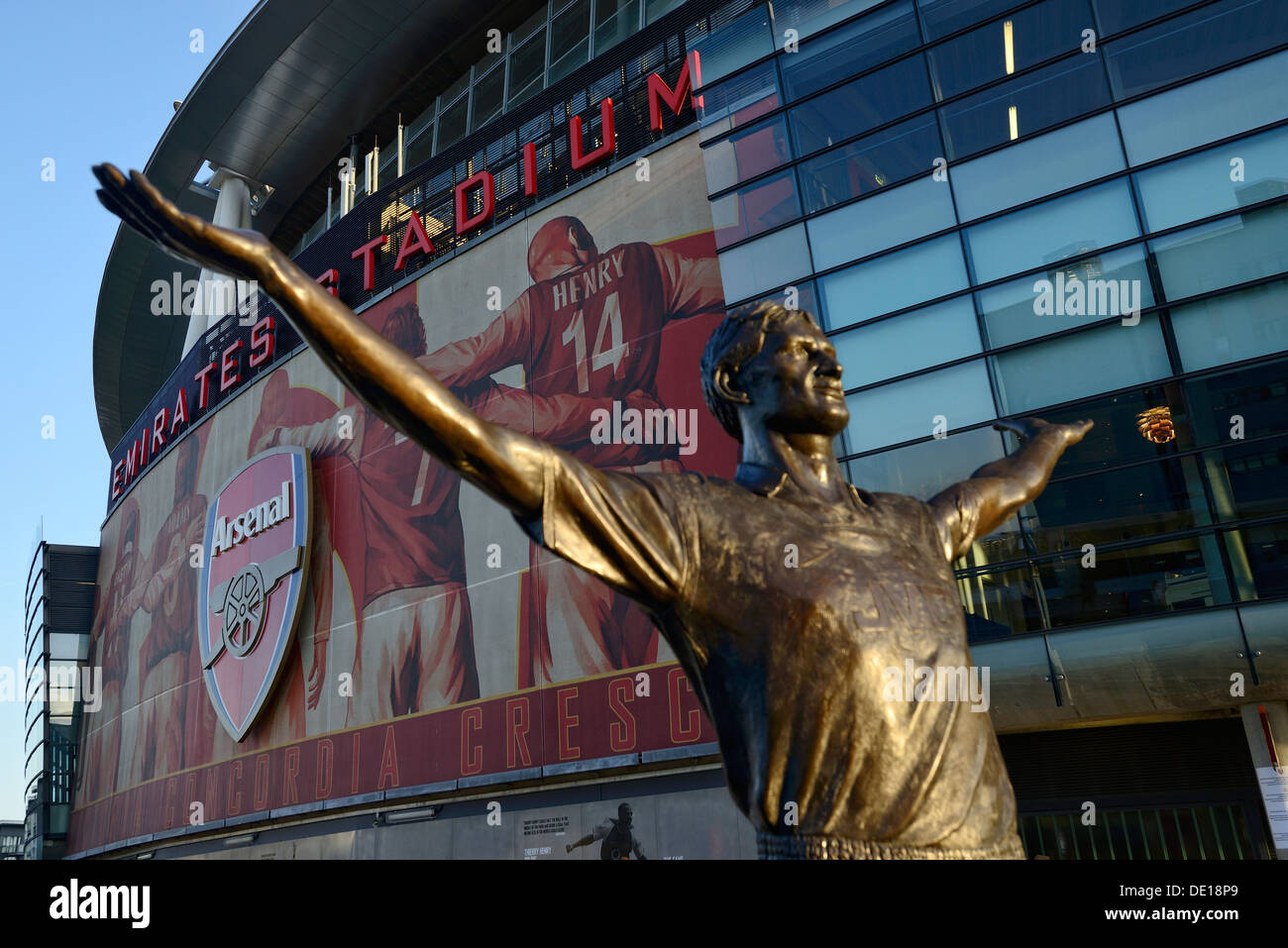 Emirates stadium at Arsenal in the evening with a sculpture of Tony ...