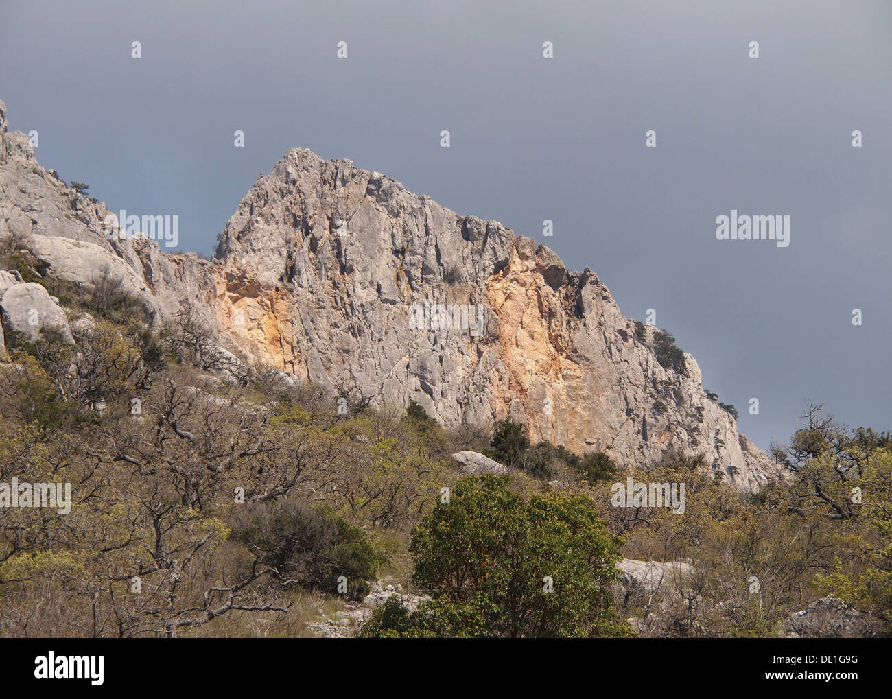 Rock, trees and sky Stock Photo - Alamy