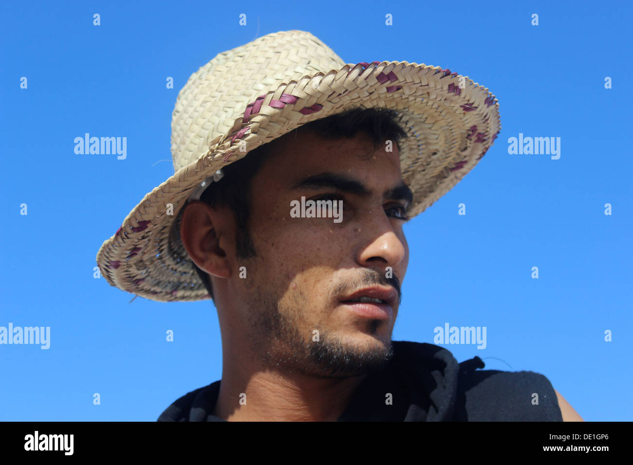 Young Berber with a traditional straw hat (called taraza Stock Photo ...
