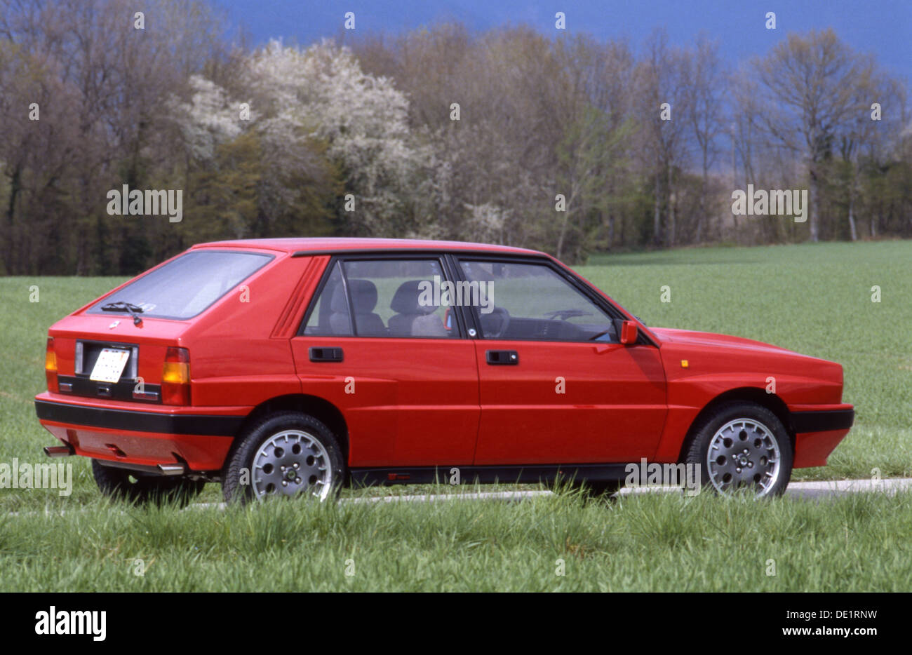 Lancia Delta Integrale Sports Car 4x4 4WD 1990s in red and driving in ...