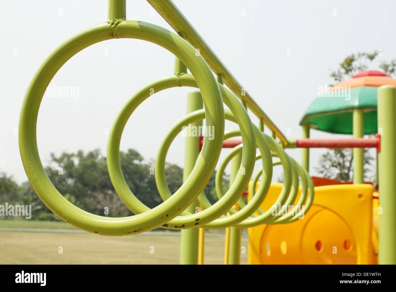 Hung hoops for swing and hang in playground Stock Photo - Alamy