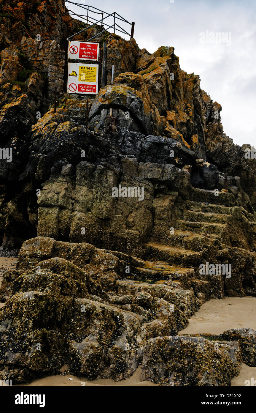 Carved stone steps climbing from the sands of castle beach up to the ...