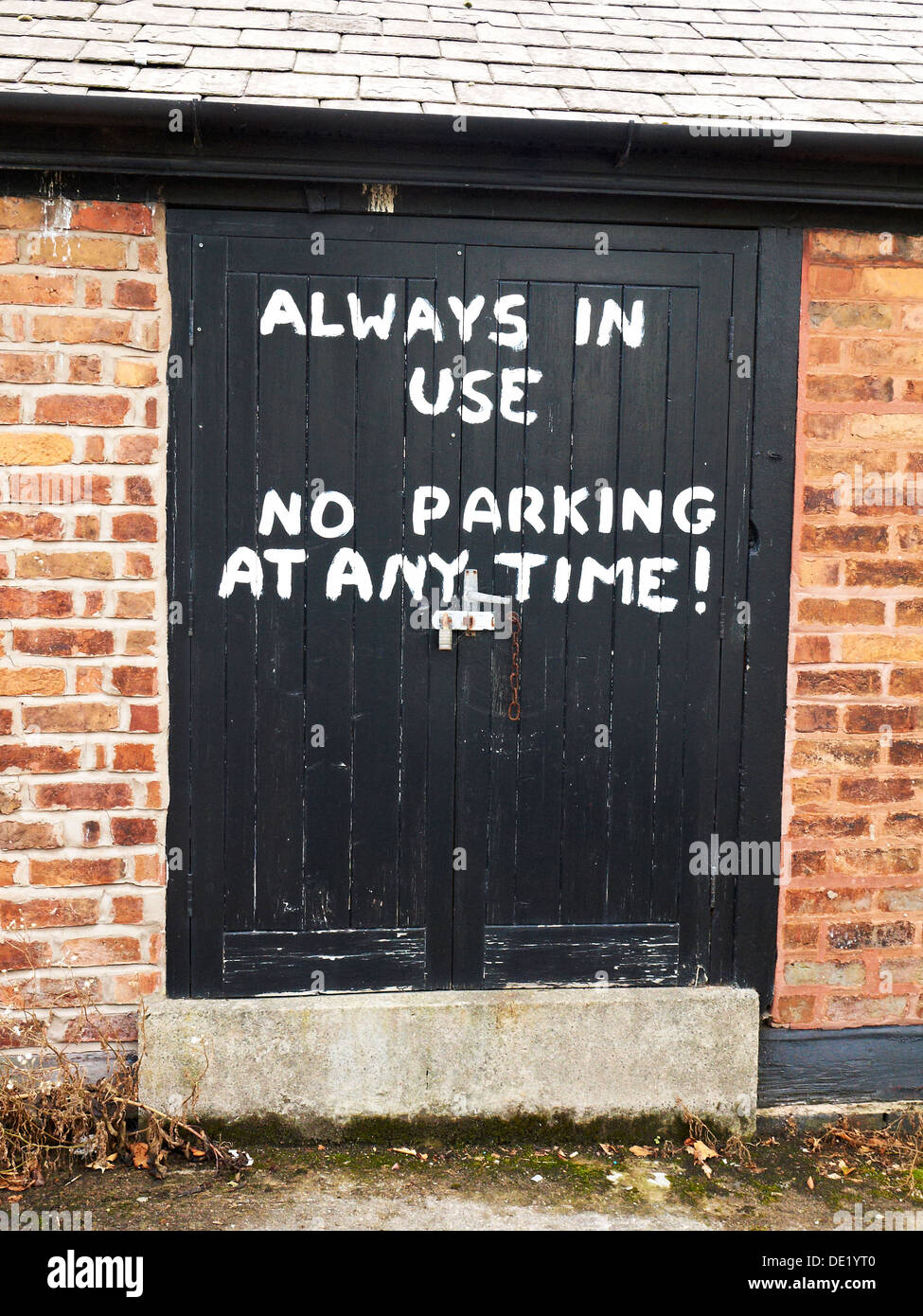 Always in use, No parking warning writing on door UK Stock Photo - Alamy