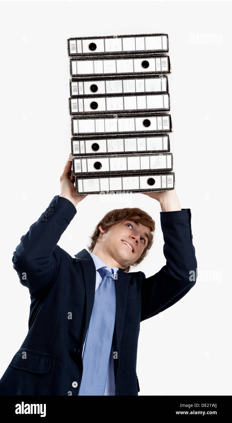 Young business man carrying a bunch of folders Stock Photo - Alamy