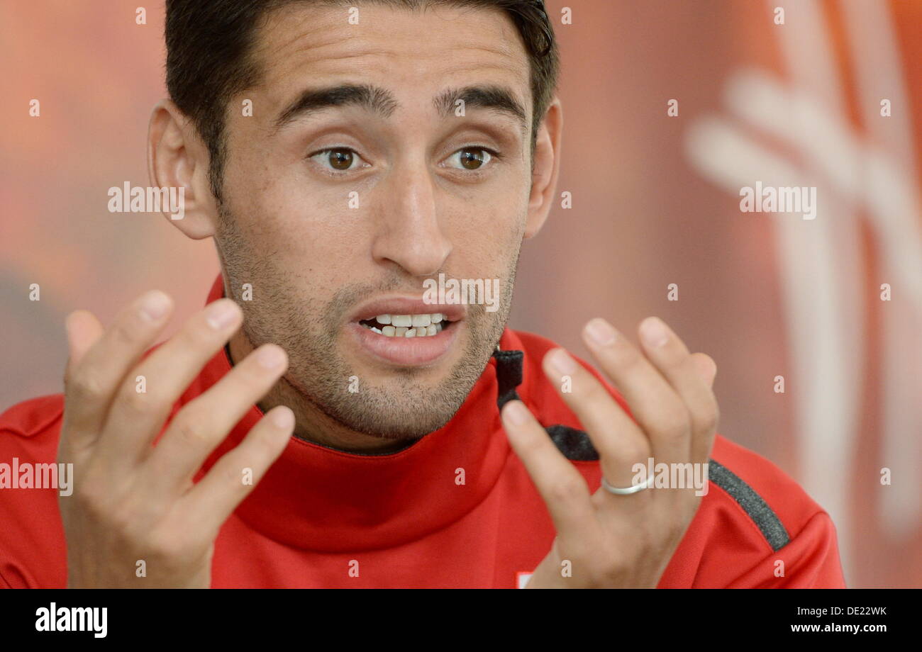 The Tunisian national soccer player, Karim Haggui, answers questions of ...