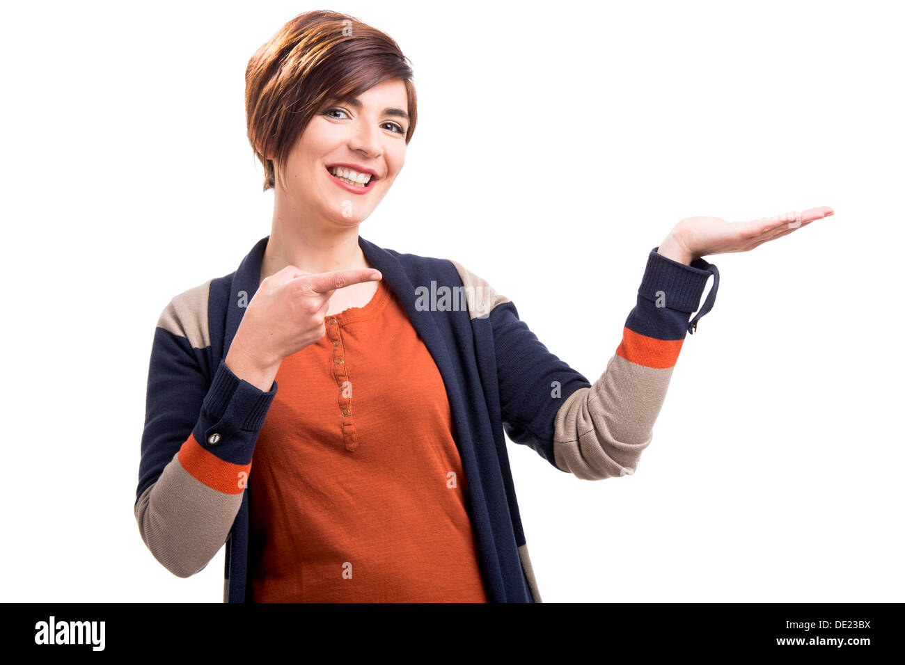 Beautiful happy woman pointing to her left hand, isolated over a white ...